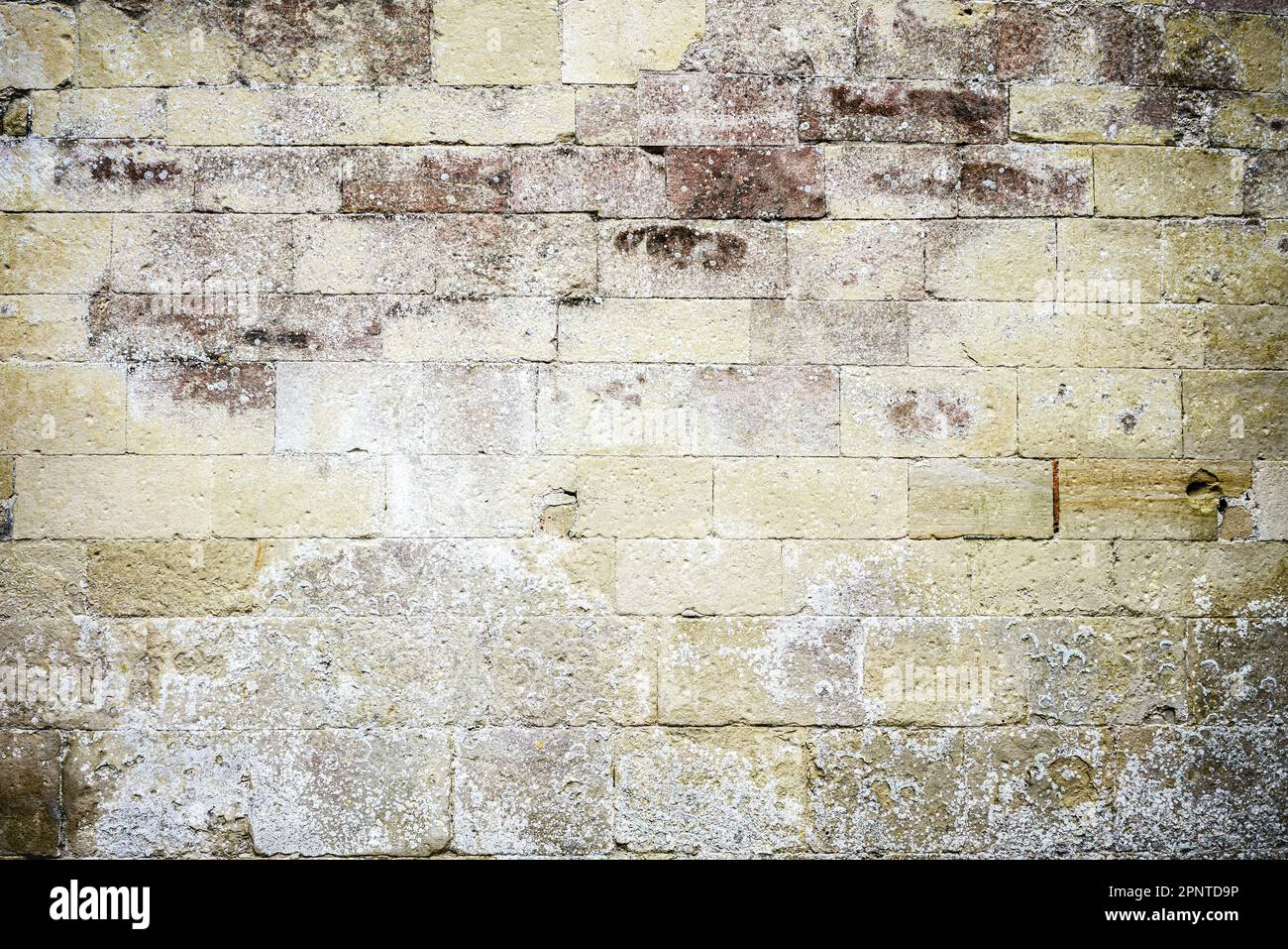 Old weathered and discoloured limestone block wall Stock Photo - Alamy