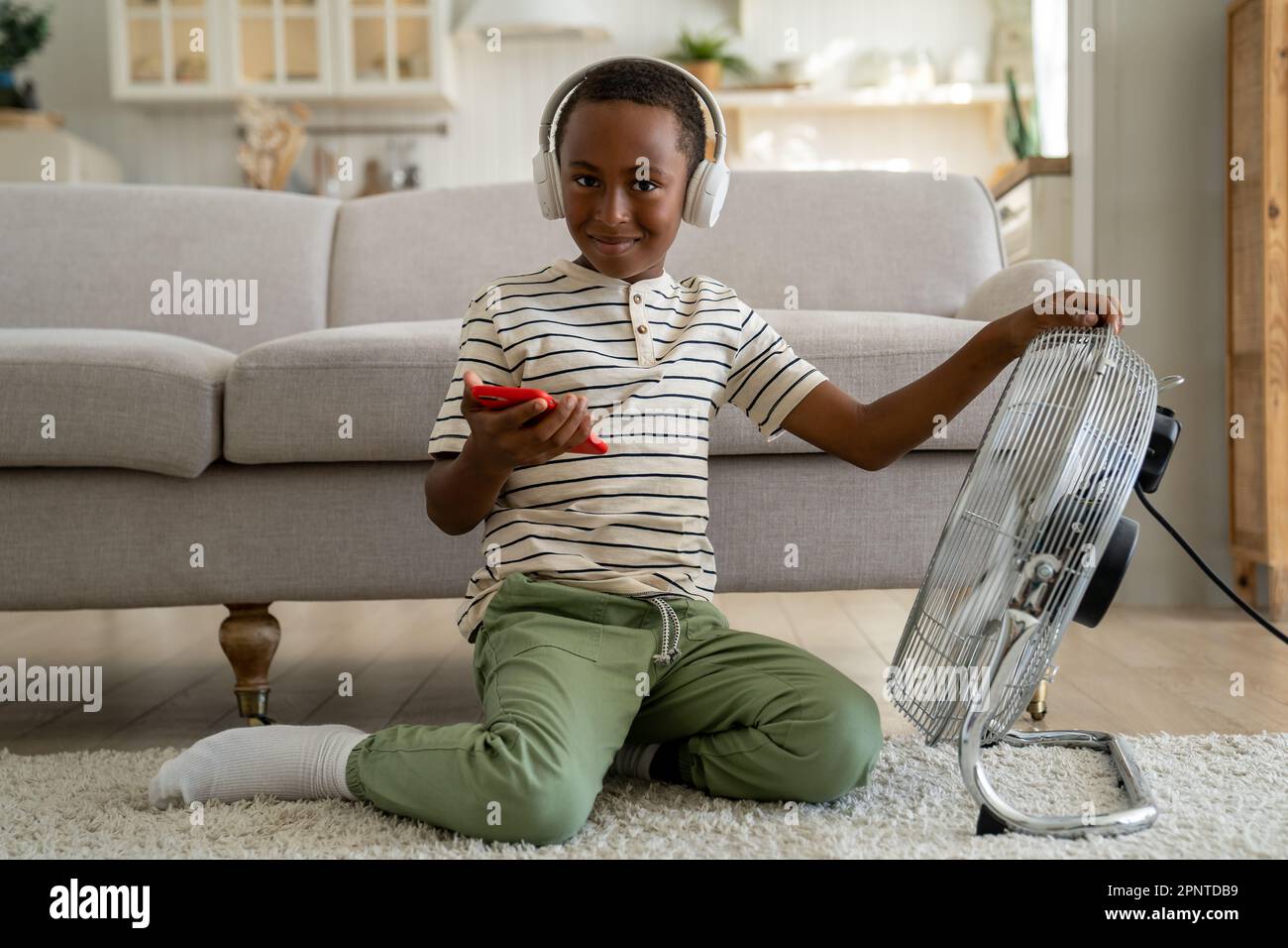 Fan blowing boy hi-res stock photography and images - Alamy