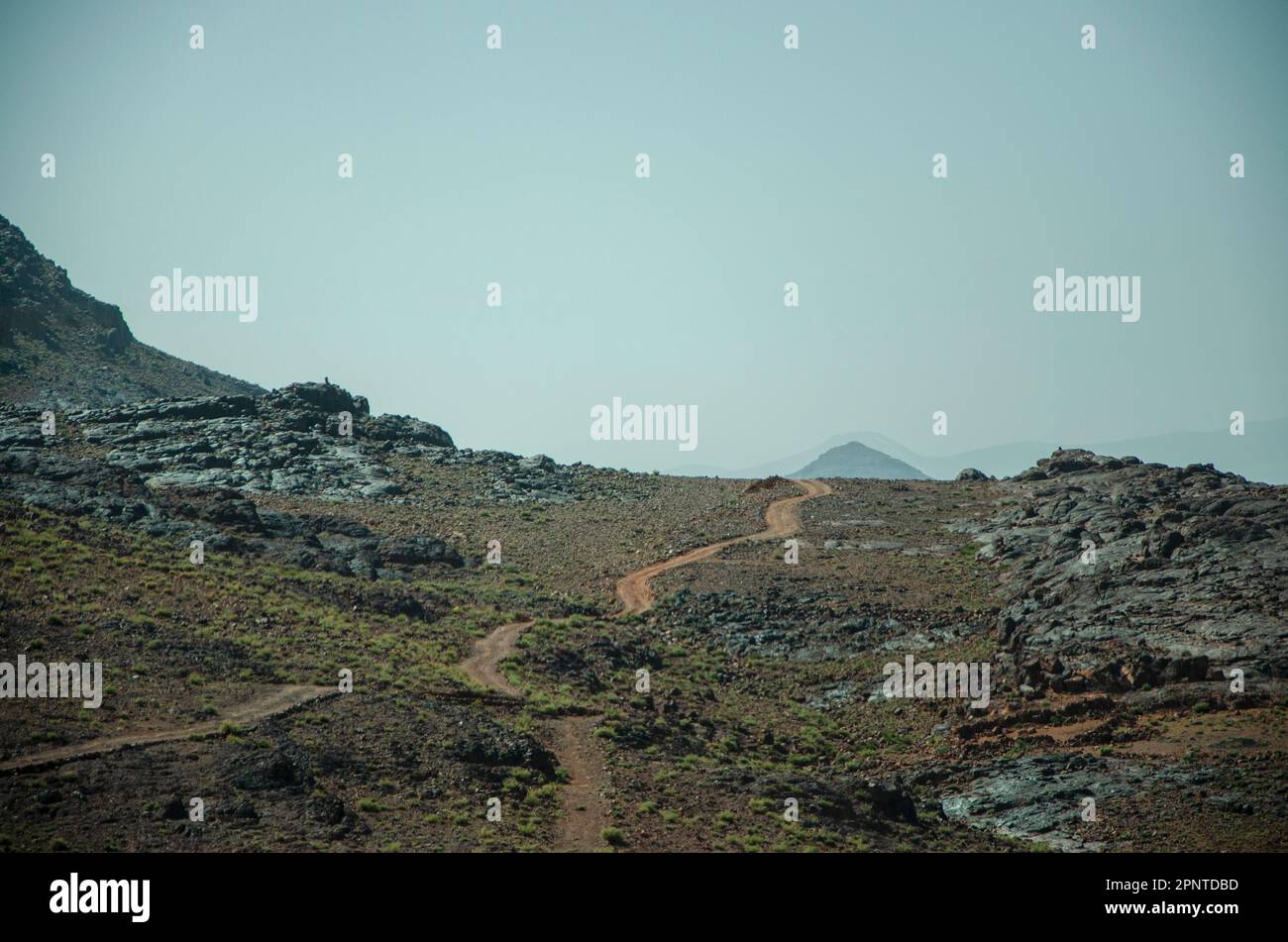 Desert landscapes in Morocco, desolate lands with paths that lead to ...