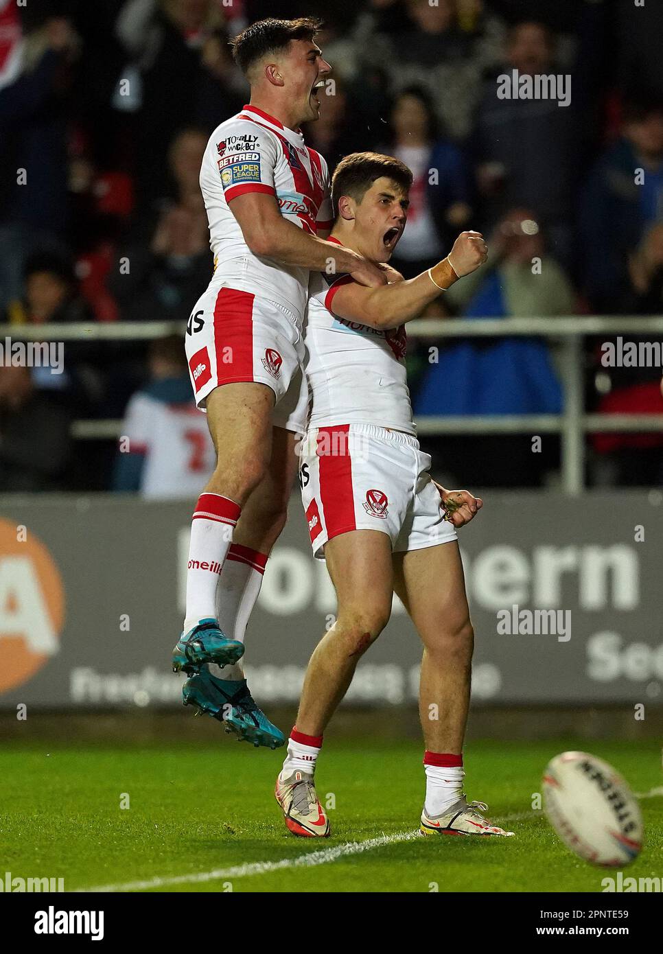 St Helens Saints' Jon Bennison (right) celebraters his try with Lewis ...