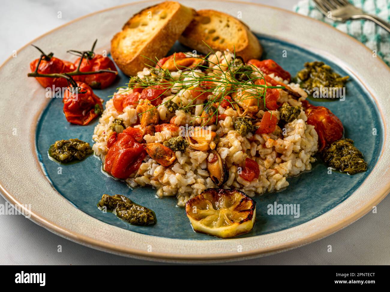 Mussels risotto with garlic and tomatoes. Above shot Stock Photo - Alamy