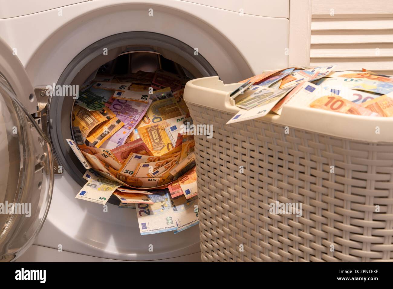 Money laundering in washing machine hi-res stock photography and images ...