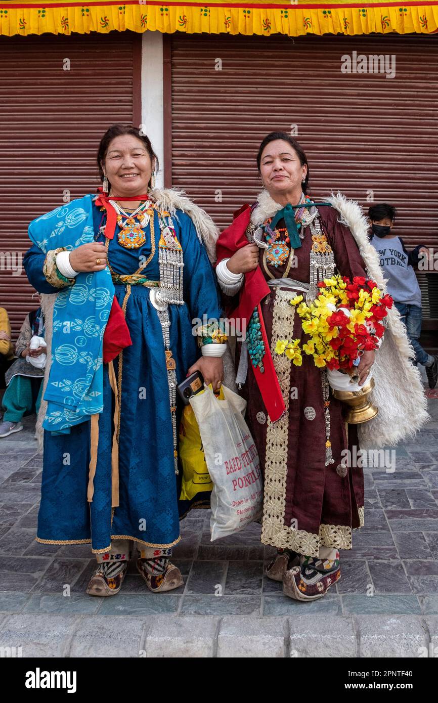 Two women in traditional dress wait for the Dalai Lama in Leh, Ladakh ...