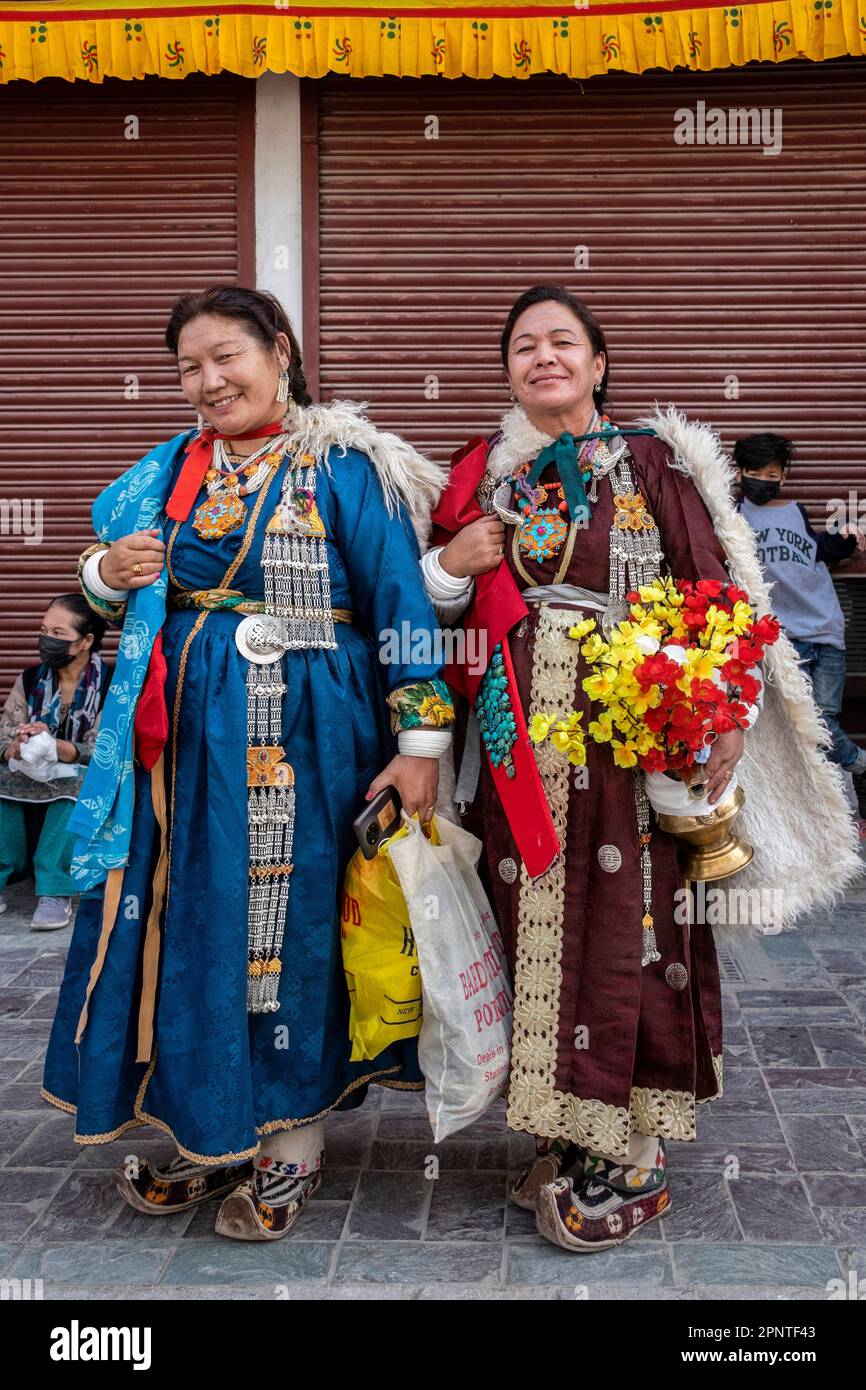 Two women in traditional dress wait for the Dalai Lama in Leh, Ladakh ...