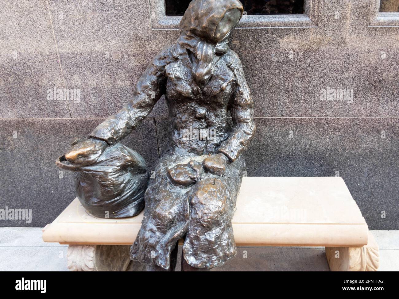 Eleanor Rigby statue in Liverpool restored on a new stone bench Stock ...