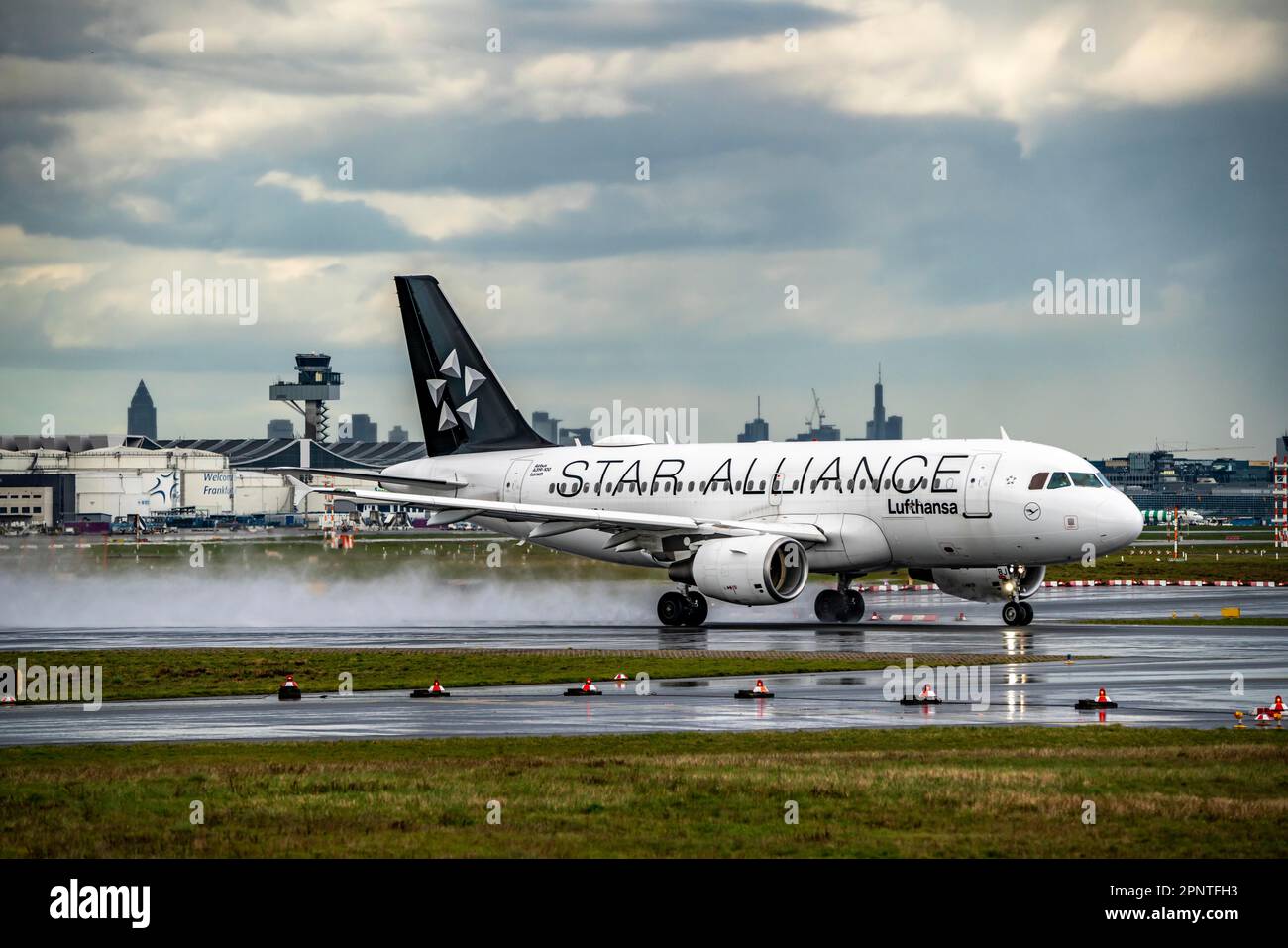 Lufthansa Airbus A319 taking off on Runway West, skyline of downtown ...