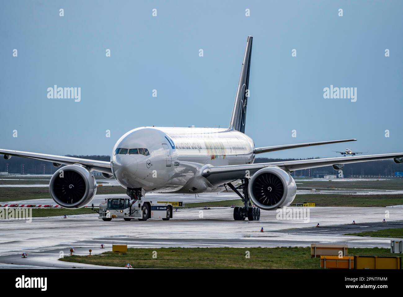 Lufthansa Cargo Boeing 777 Cargo, Jet being towed over a taxiway ...