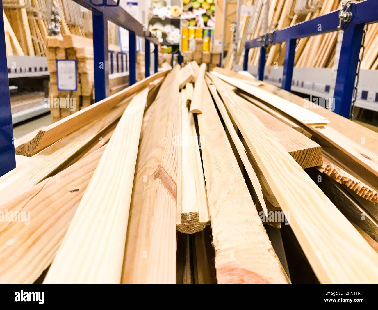 Wooden brown sawn natural building boards stick logs with knots on a ...