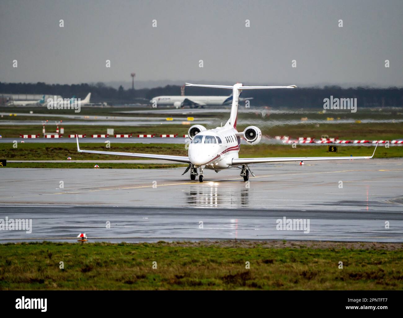 Private jet, Embraer Phenom 300 F-GXAE, on Runway West, Frankfurt am ...