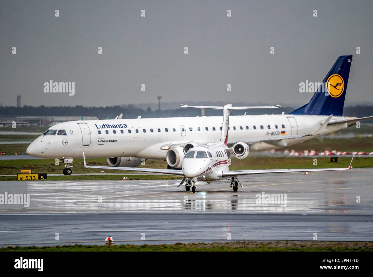 Private jet, Embraer Phenom 300 F-GXAE, on Runway West, Frankfurt am ...