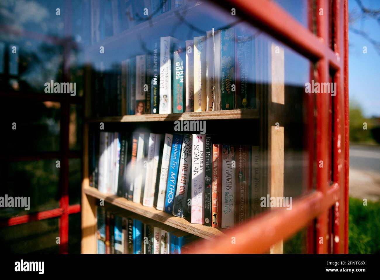 A phone box library viewed through a window Stock Photo - Alamy