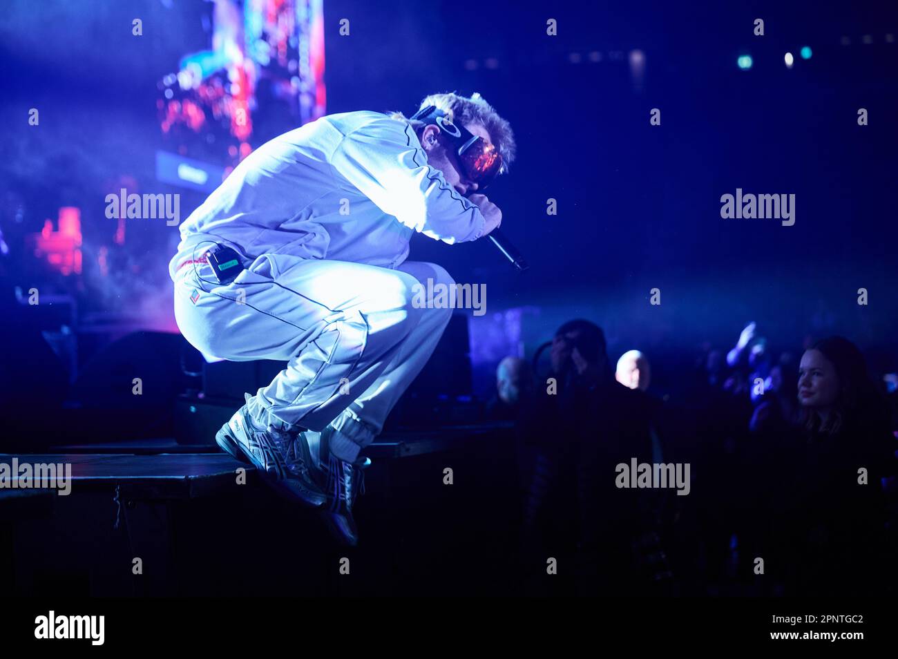 Berlin, Germany. 20th Apr, 2023. Singer Ski Aggu jumps off the stage ...