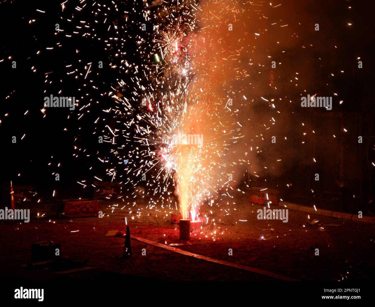 A red fire hydrant illuminated by fiery sparks in the night Stock Photo ...