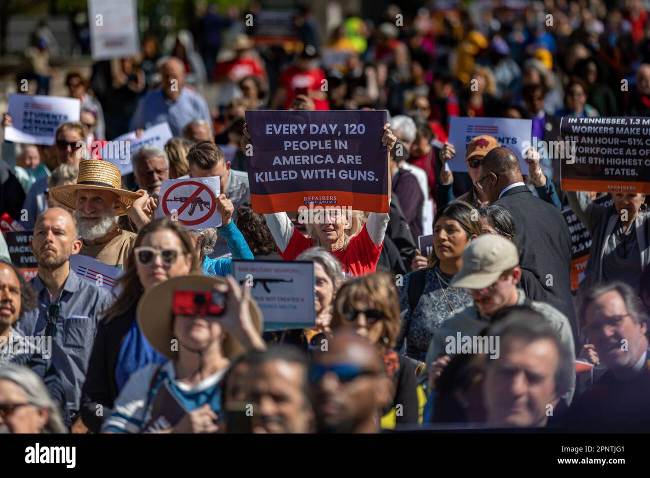 A gun safety advocate holds a sign outside of the Tennessee Capitol ...