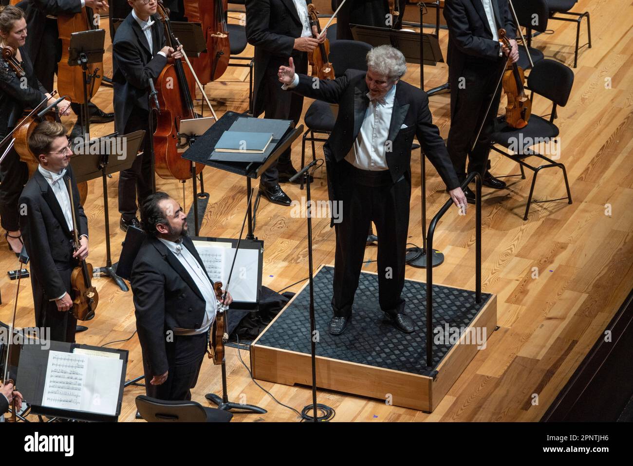 conductor Vassily Sinaisky acknowledging applause, classical concert ...