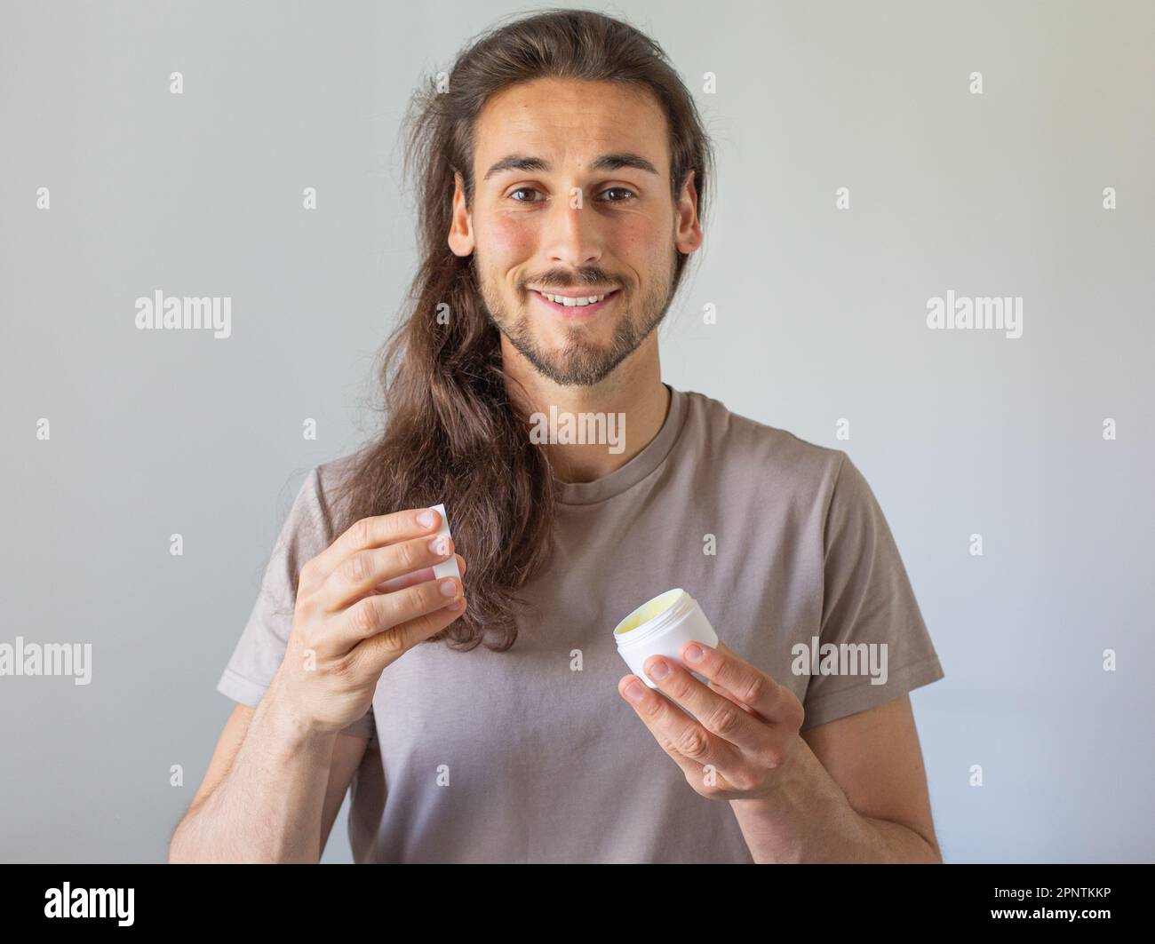 Long hair man face care Stock Photo - Alamy