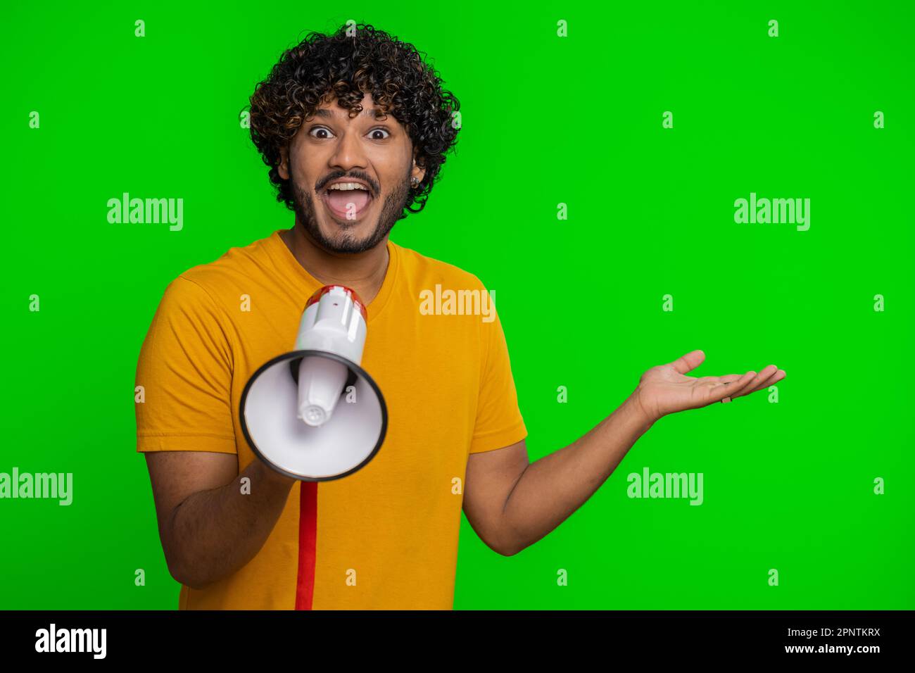 Indian man talking with megaphone, proclaiming news, loudly announcing ...