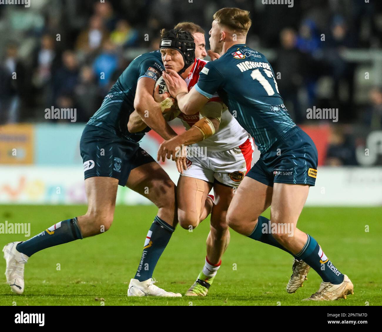 Jonny Lomax #6 of St Helens is tackled by Matty Nicholson #12 and James ...