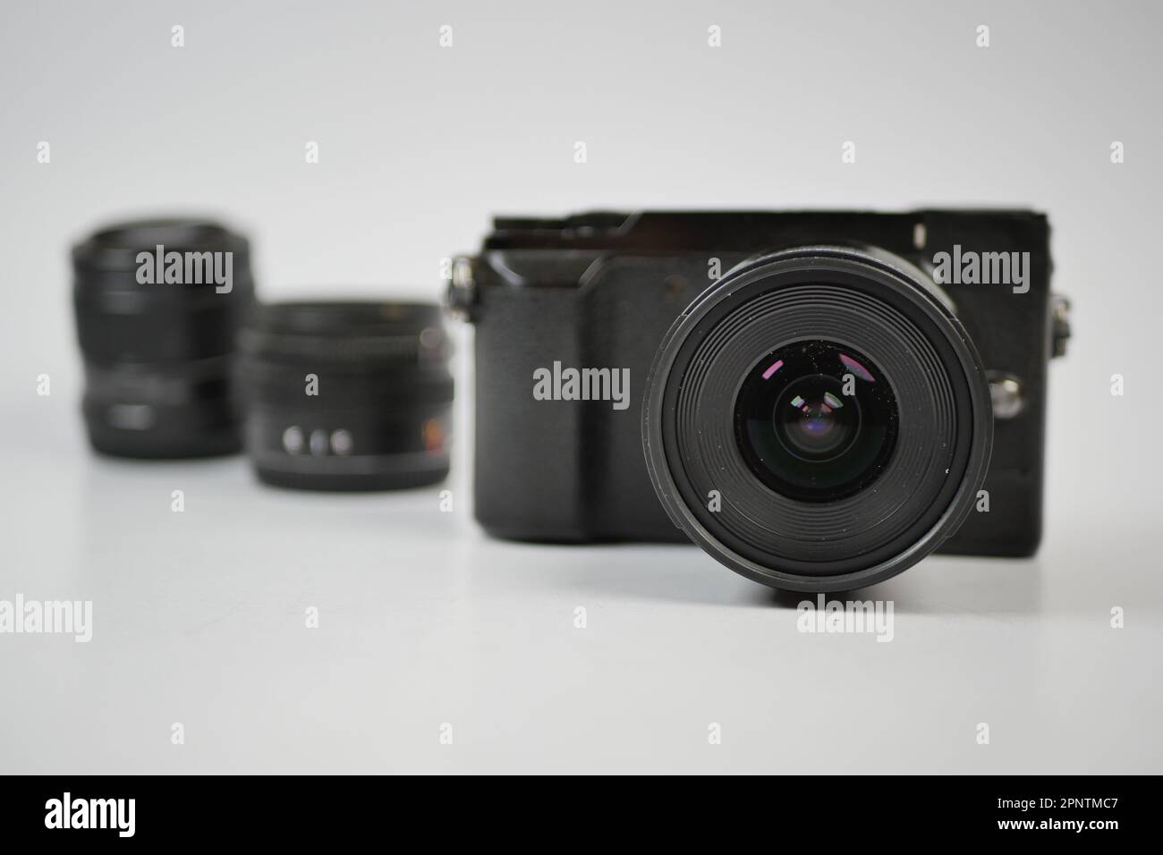 a black color mirrorless camera and lens on white background Stock ...