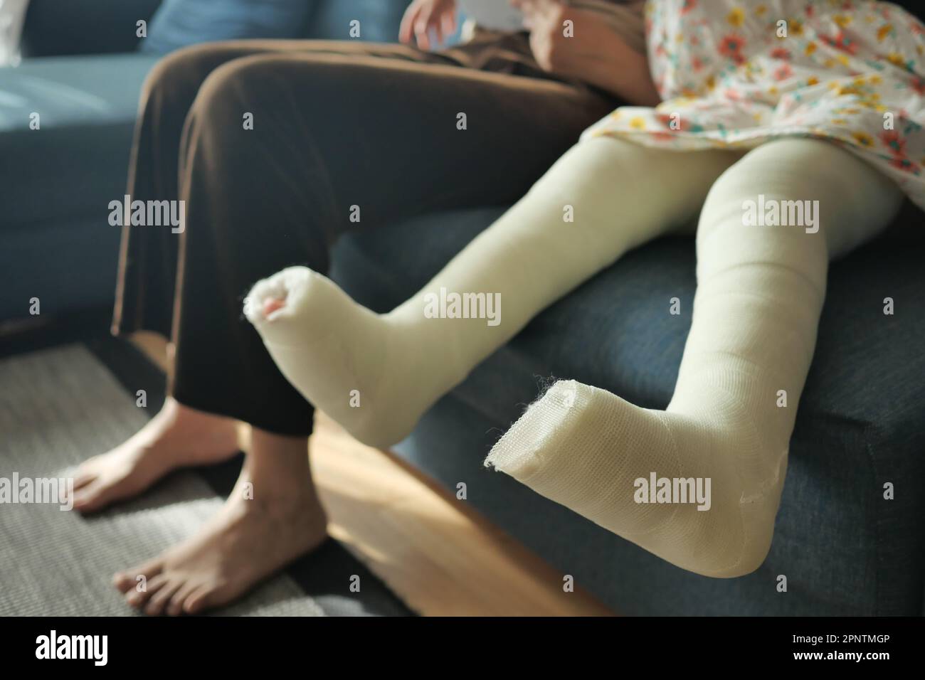 little child with plaster bandage on leg Stock Photo - Alamy