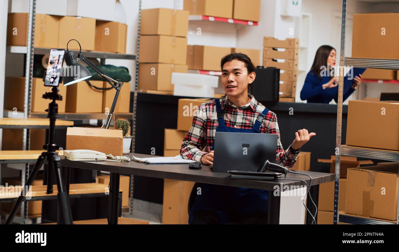 Asian worker promoting supplies on online ad video, recording promotion ...