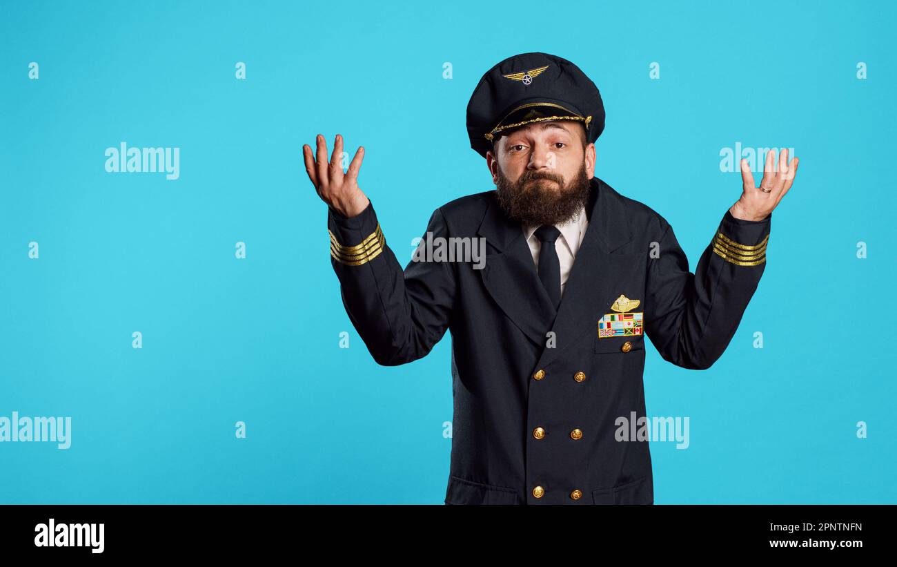 Clueless flying pilot doing i dont know gesture, acting uncertain and ...