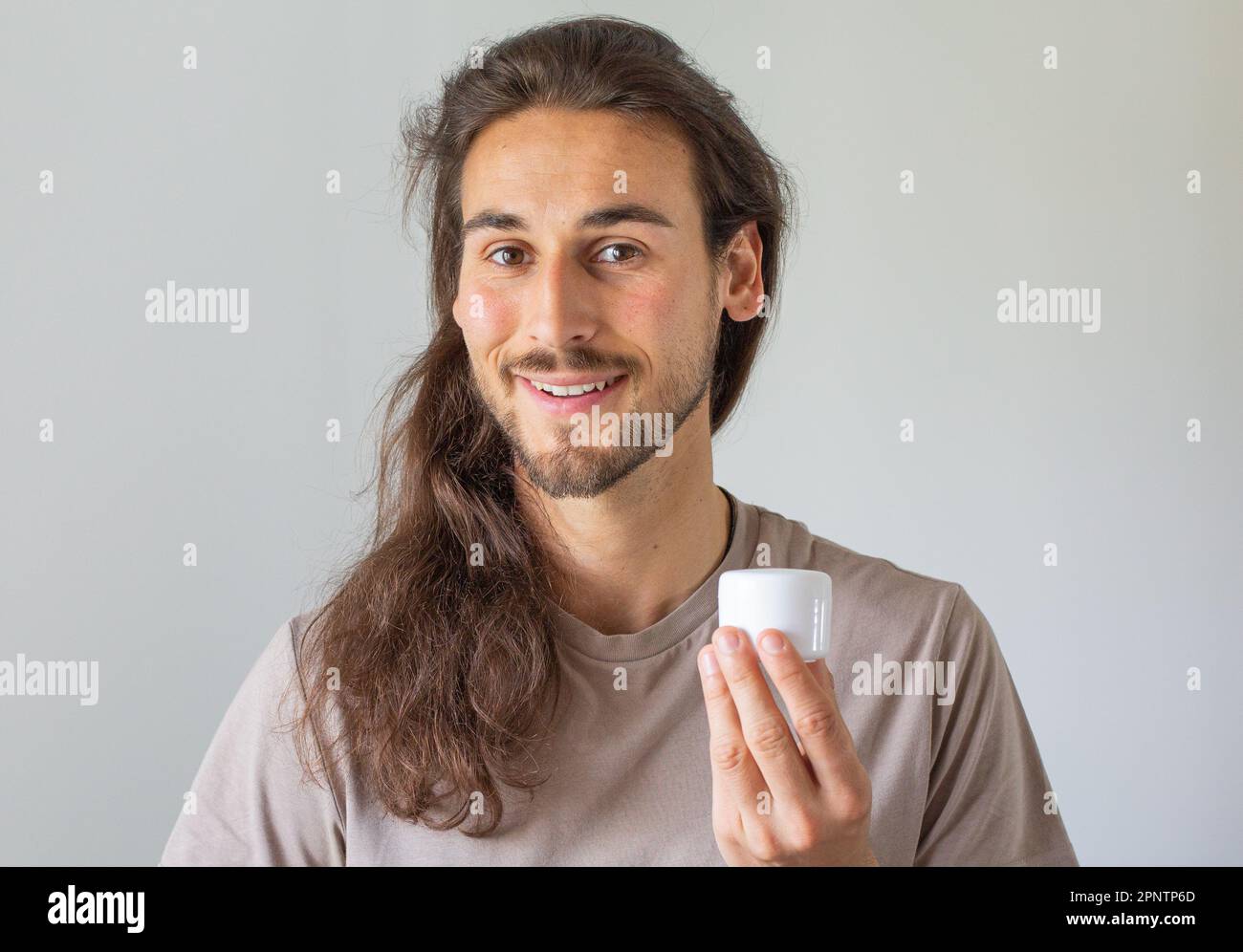 Long hair man face care Stock Photo - Alamy