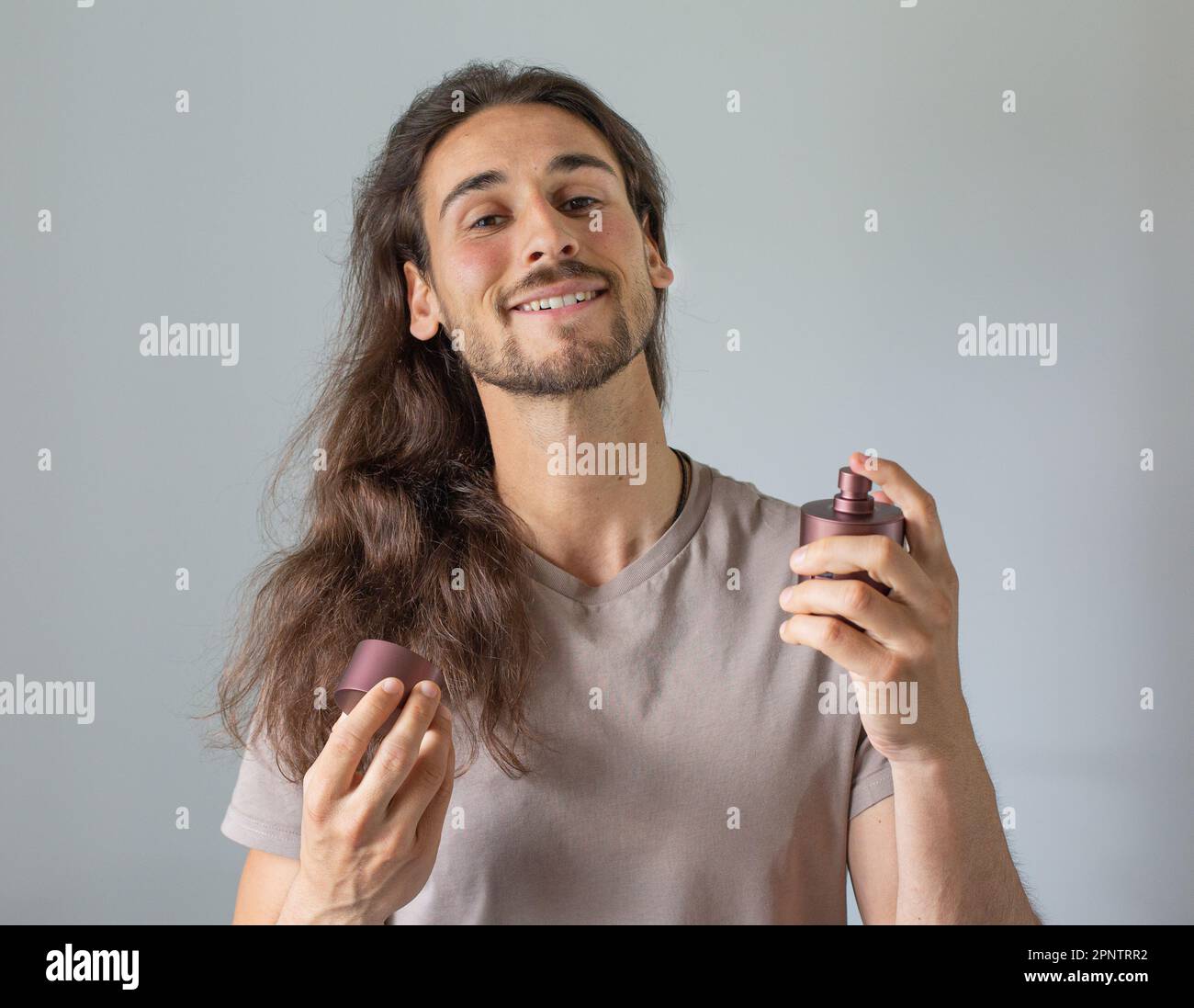 Long hair man face care Stock Photo - Alamy
