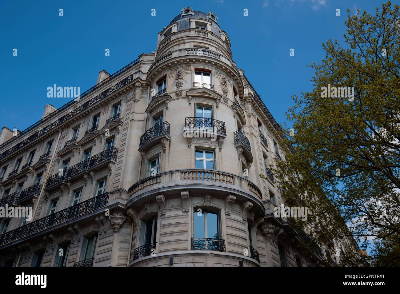 The facade of traditional French house with typical balconies and ...