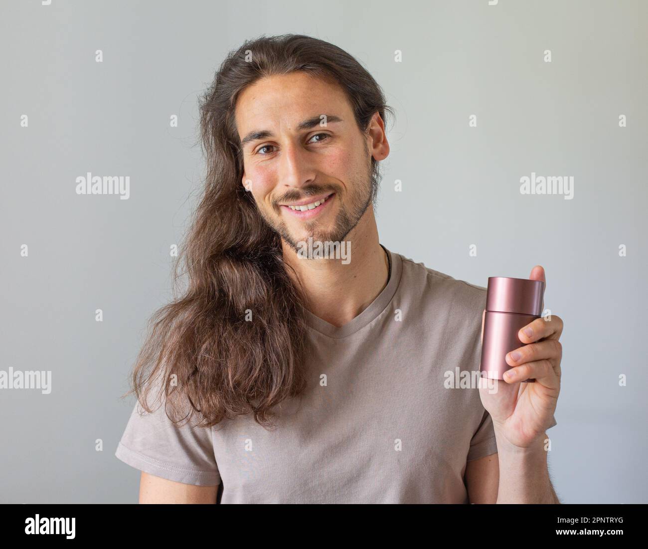 Long hair man face care Stock Photo - Alamy