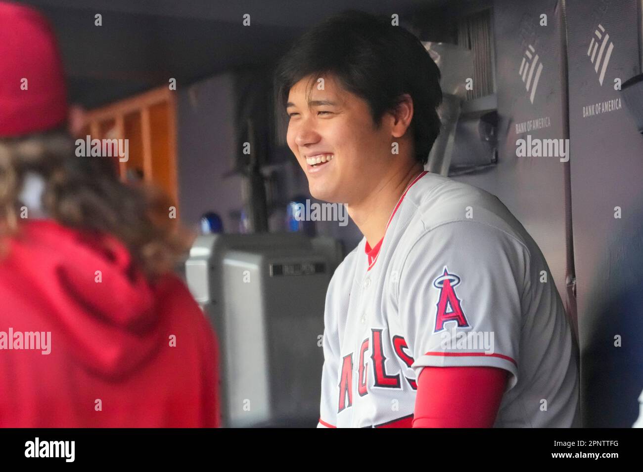 Los Angeles Angels' Shohei Ohtani smiles in the dugout in the fifth ...