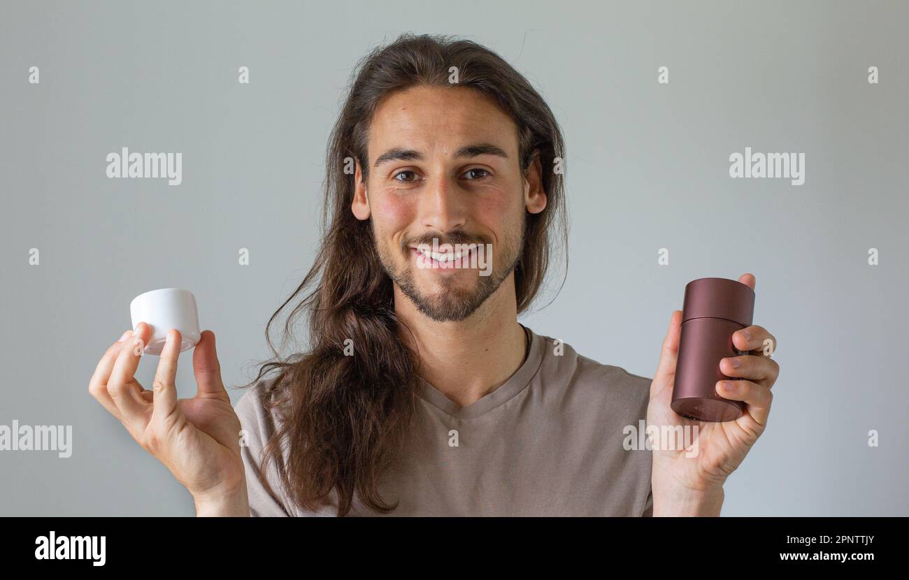 Long hair man face care Stock Photo - Alamy