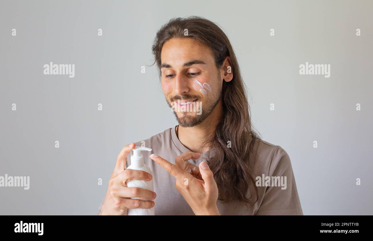 Long hair man face care Stock Photo - Alamy