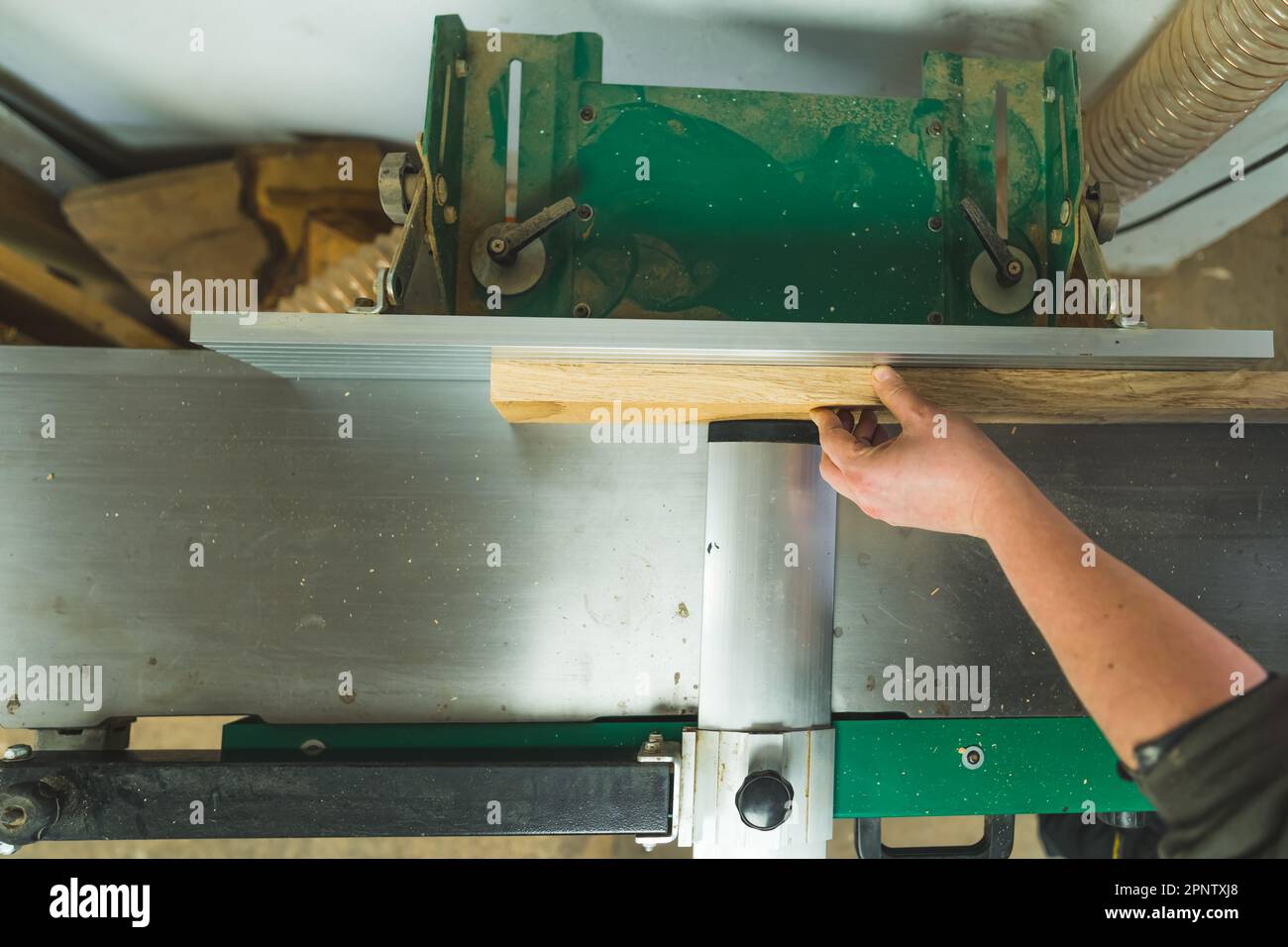 Carpentry and woodworking concept. Carpenter's hand holding piece of ...