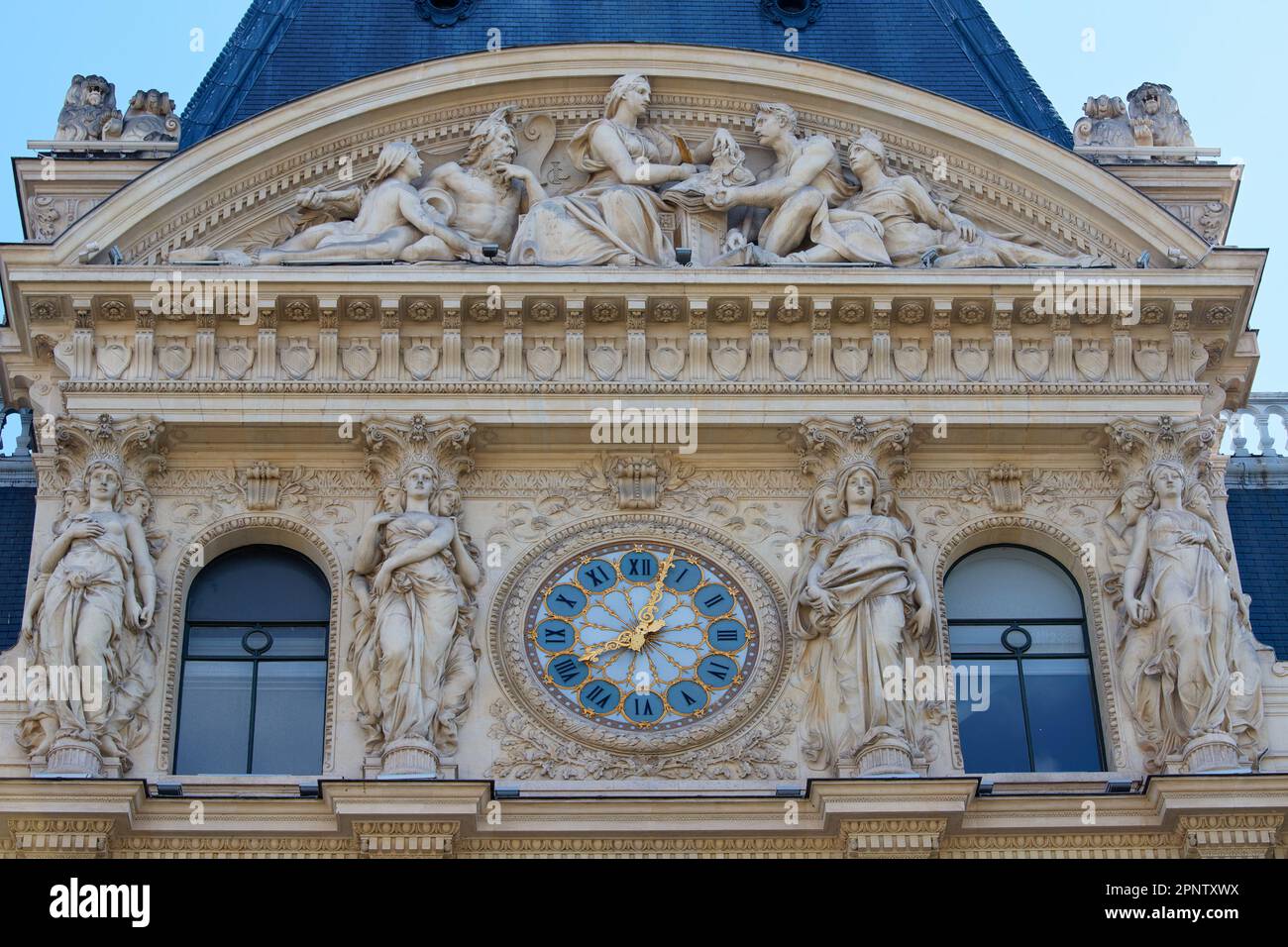Giant clock on the facade of a building in Paris Stock Photo - Alamy