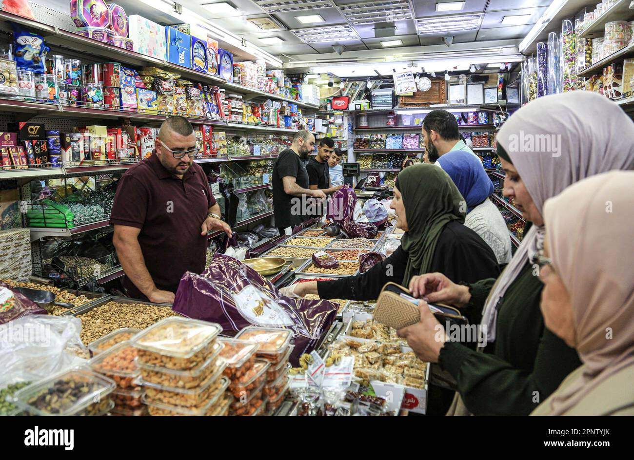 People flock to city bazaar to do shopping for the upcoming Eid Al-Fitr holiday in Jerusalem ...