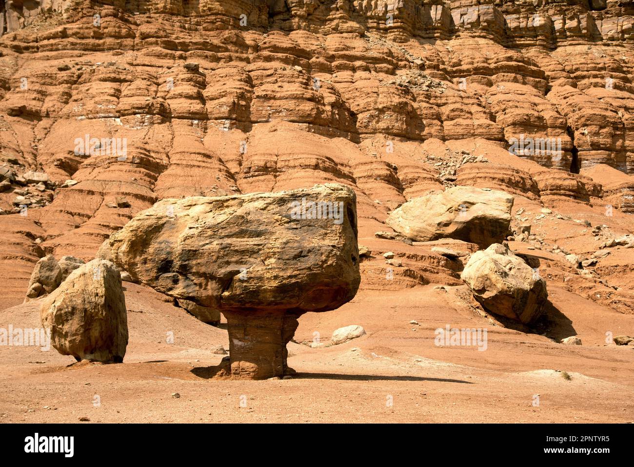 Erosion exposes large boulders at the base of the Vermillion Cliffs in ...