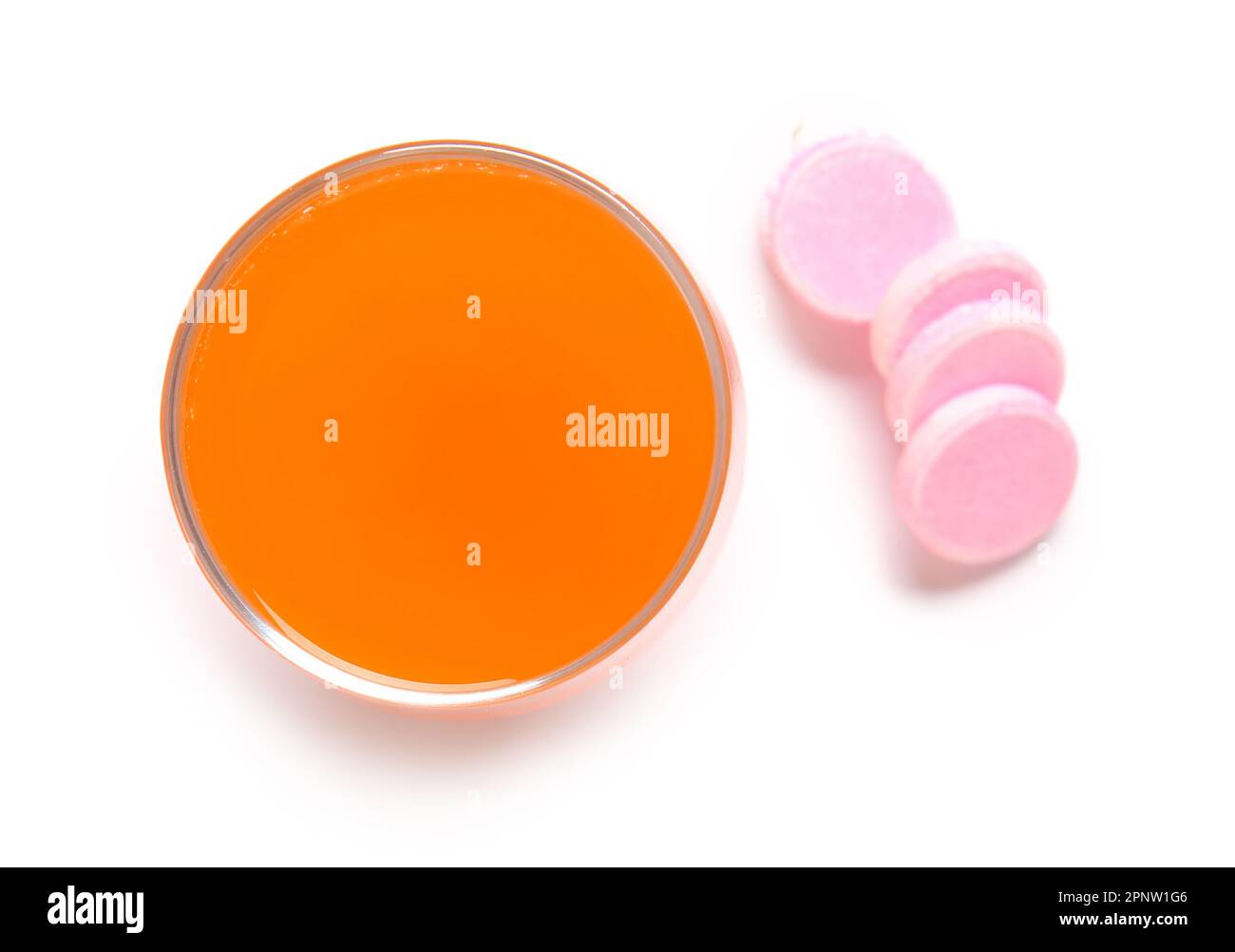 Glass of effervescent tablet dissolved in water and pills isolated on ...