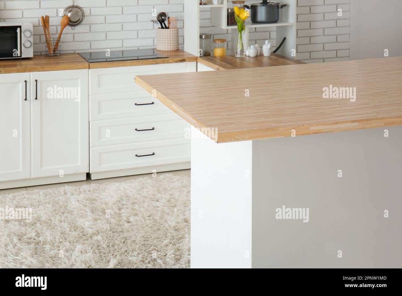 Empty table in interior of modern kitchen Stock Photo - Alamy