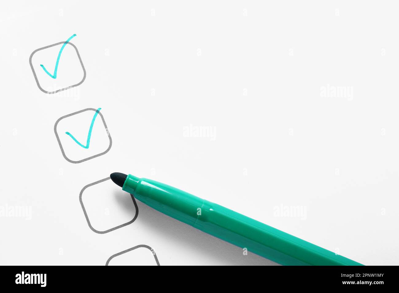 Checklist box with marks and green marker, closeup Stock Photo - Alamy