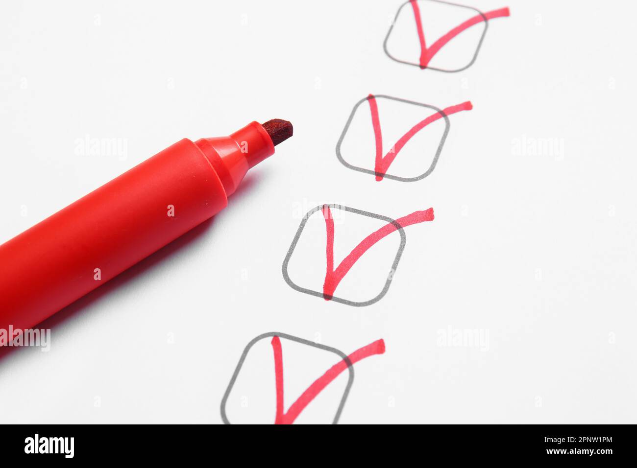 Checklist box with red marker, closeup Stock Photo - Alamy