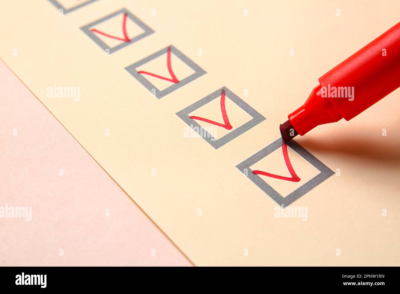 Red pen marking on checklist box, closeup Stock Photo - Alamy