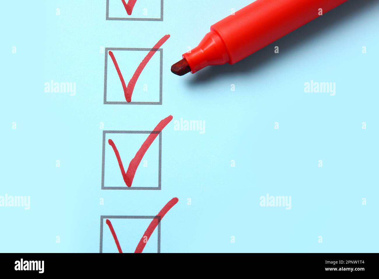 Checklist box with red marker, closeup Stock Photo - Alamy