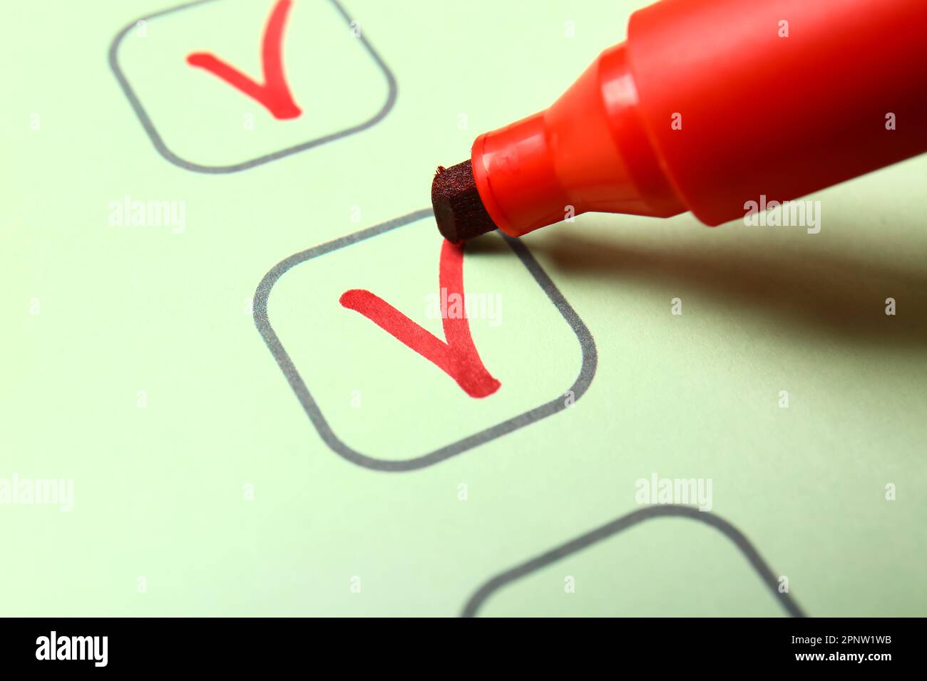 Red pen marking on checklist box, closeup Stock Photo - Alamy