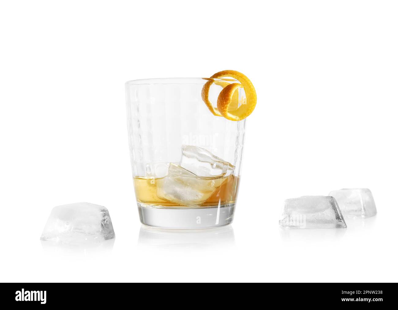Glass of rum with ice cubes and orange peel on grey background Stock ...