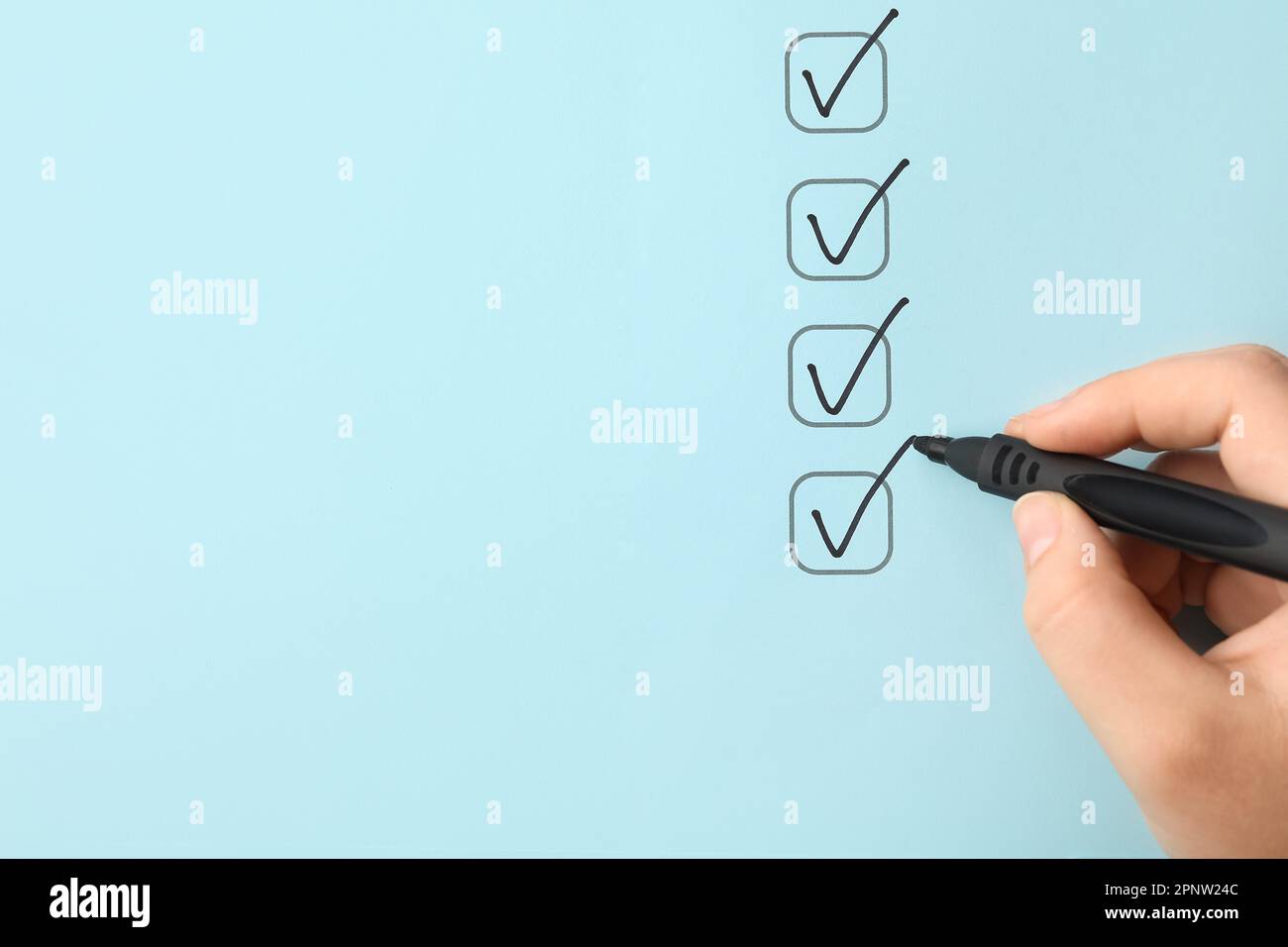 Woman marking on checklist box with black marker Stock Photo - Alamy