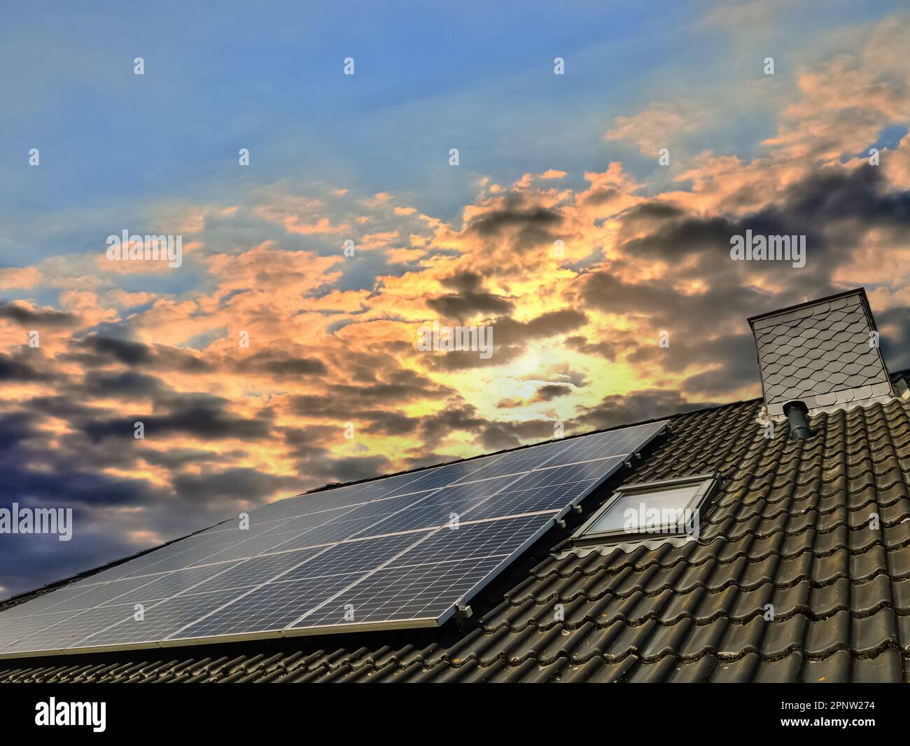 Solar panels producing clean energy on a roof of a residential house ...