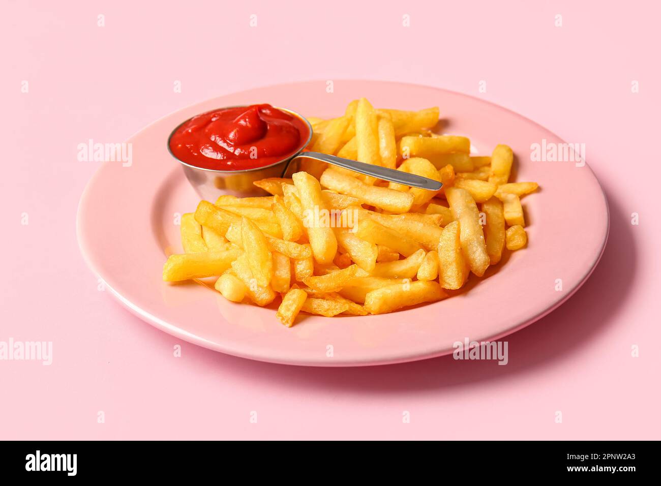 Plate of tasty french fries and ketchup on pink background Stock Photo ...