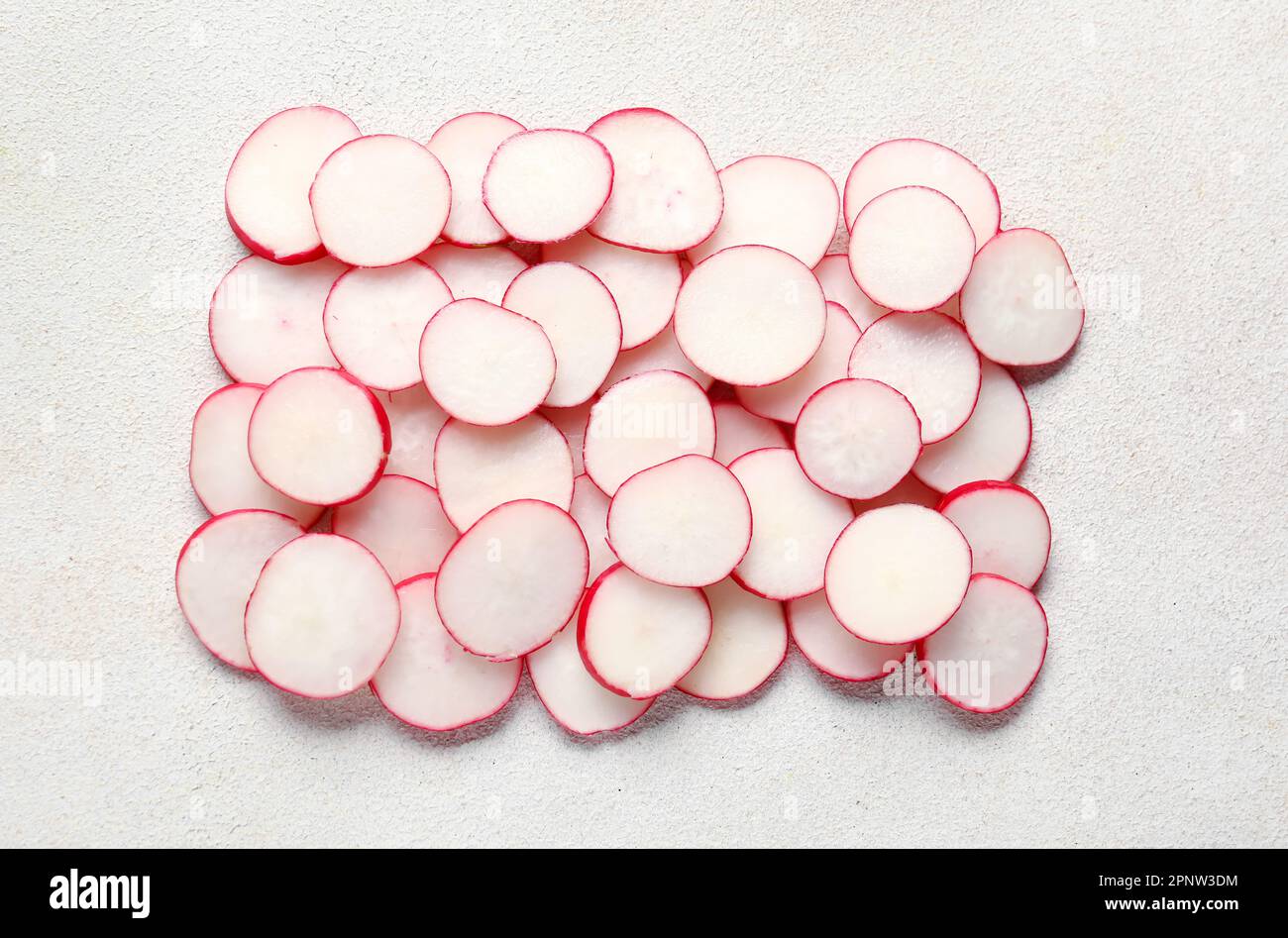 Fresh sliced radish on white background Stock Photo - Alamy