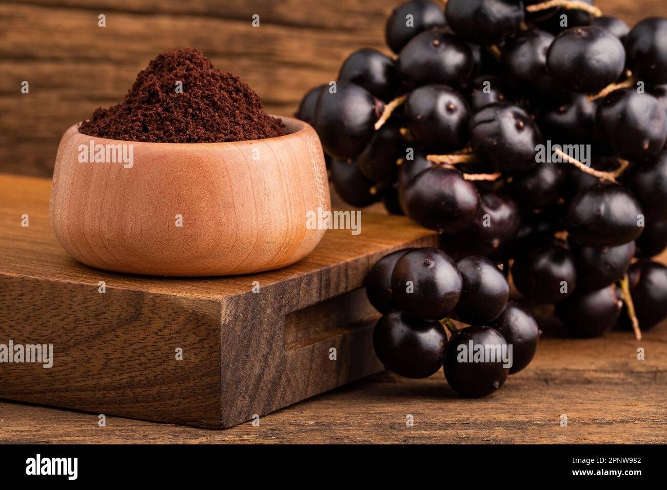 Amazonian acai berries and powder - Euterpe oleracea Stock Photo - Alamy
